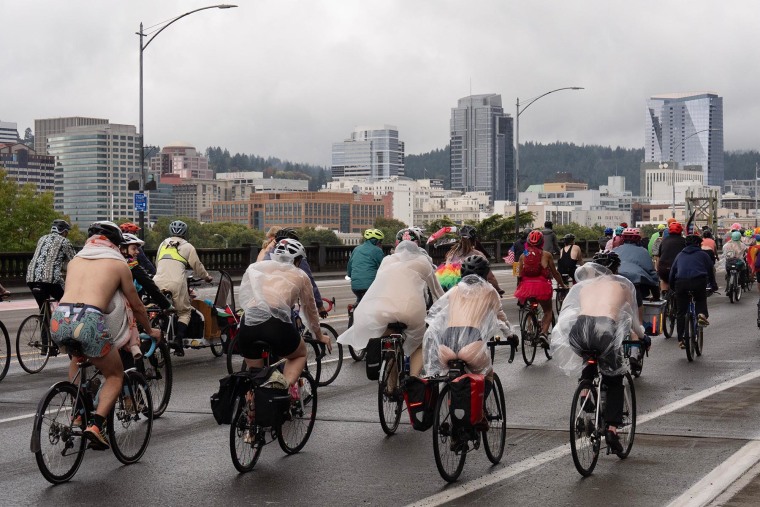 In Portland, nude cyclists join anti-ICE protests in rain-soaked ride