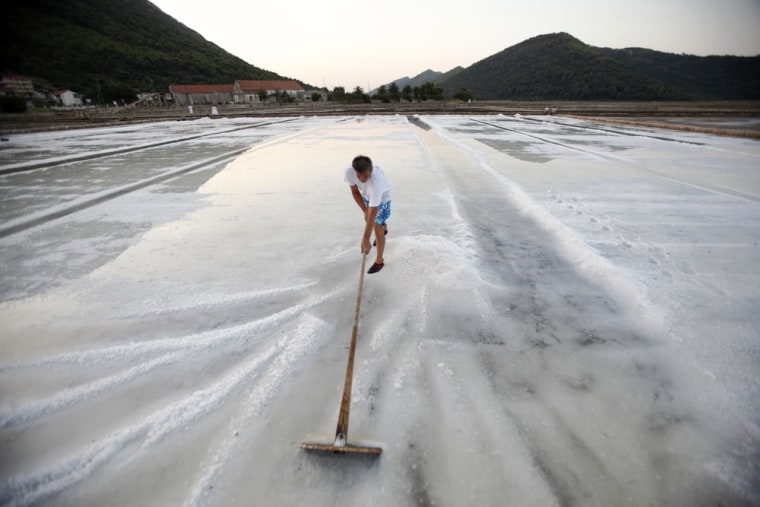 Volunteers harvest Ston salt from historic Croatian site