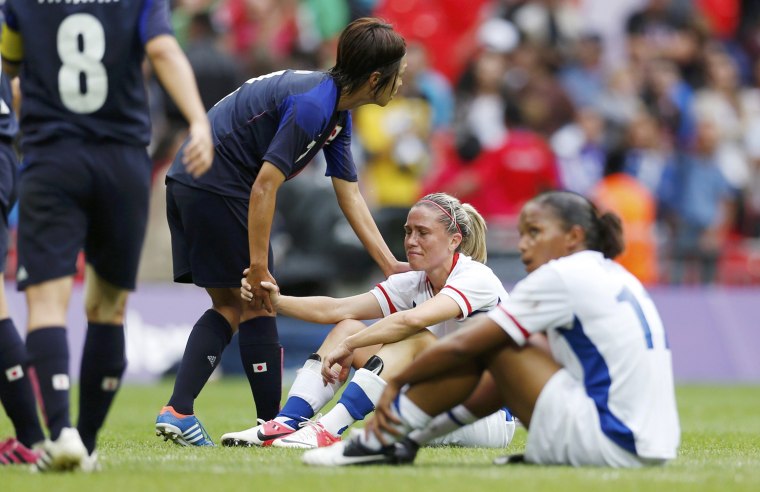 A moment of true sportsmanship, as Japan consoles a defeated France