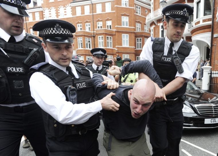 Taxi for Julian Assange? Supporters scuffle with cops outside Ecuador ...