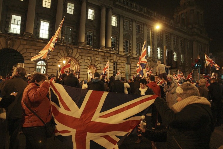 Cops hurt as British unionist protesters try to storm Belfast City Hall ...