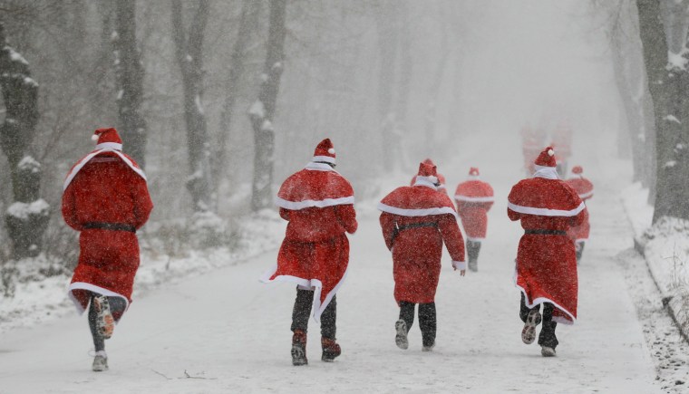 Santa stampede! Germans run in red suits and beards