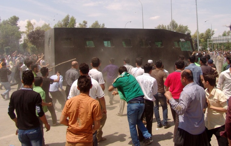 Kurdish protesters smash stores and police vehicle in northern Iraq