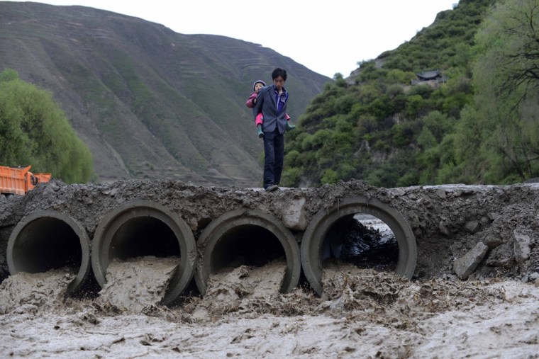 Raging torrent of mud follows deadly China rain storms