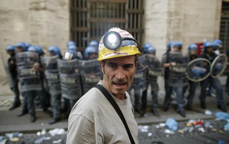 Hard hats and police shields: Alcoa workers clash with police in Rome