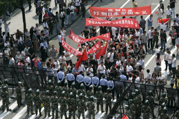 Thousands protest in China over disputed islands on the anniversary of ...