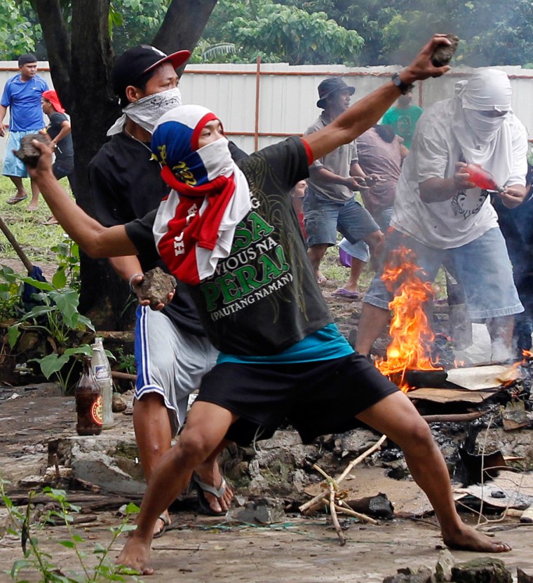 Squatters clash with police over demolition of their homes in the ...