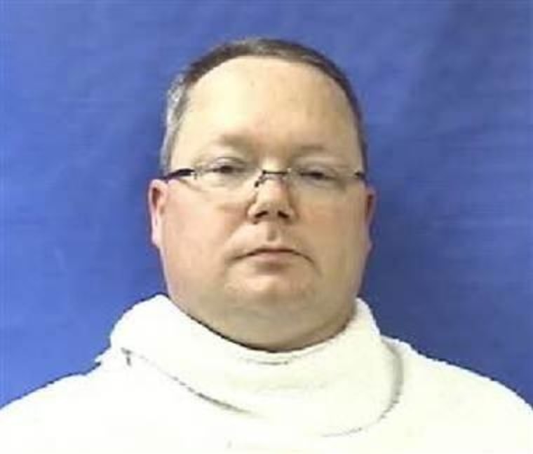 Former justice of the peace charged with murder in case of slain Texas DA