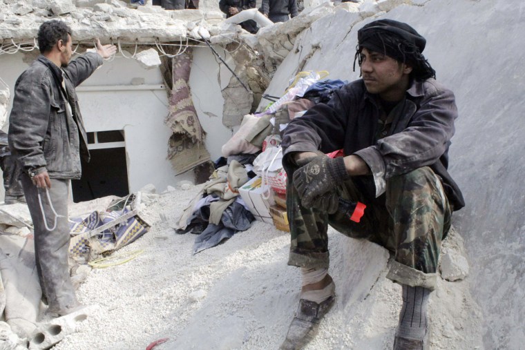 Syrian rocket destroys 3 buildings, kills 20, activists say