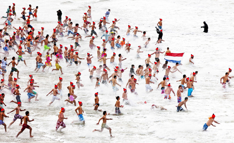 Revelers plunge into icy waters to celebrate New Year