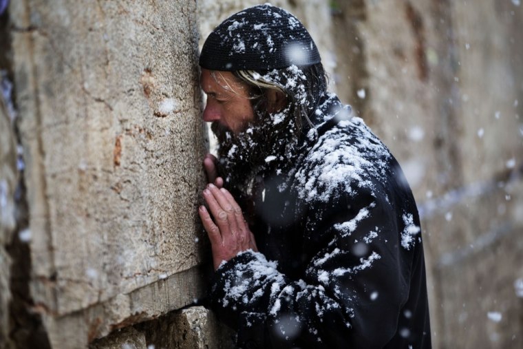 Rare snowstorm blankets Holy Land, brings brief joy to war-weary Damascus
