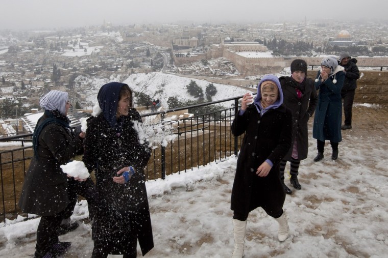 Rare snowstorm blankets Holy Land, brings brief joy to war-weary Damascus