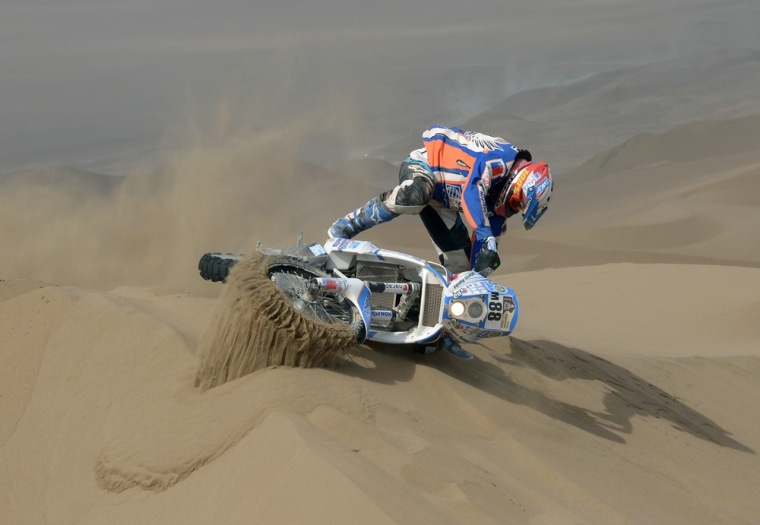 Competitors get stuck in, and escape, the sand dunes on Stage 6 of the ...