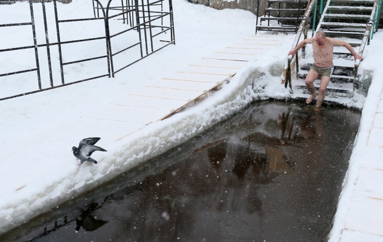 Brrrrr! Orthodox Christians celebrate Epiphany with an ice water bath