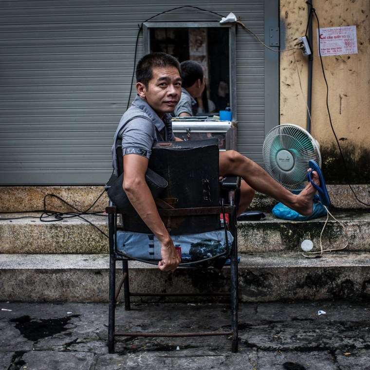 Young and old, Hanoi's street barbers continue long tradition