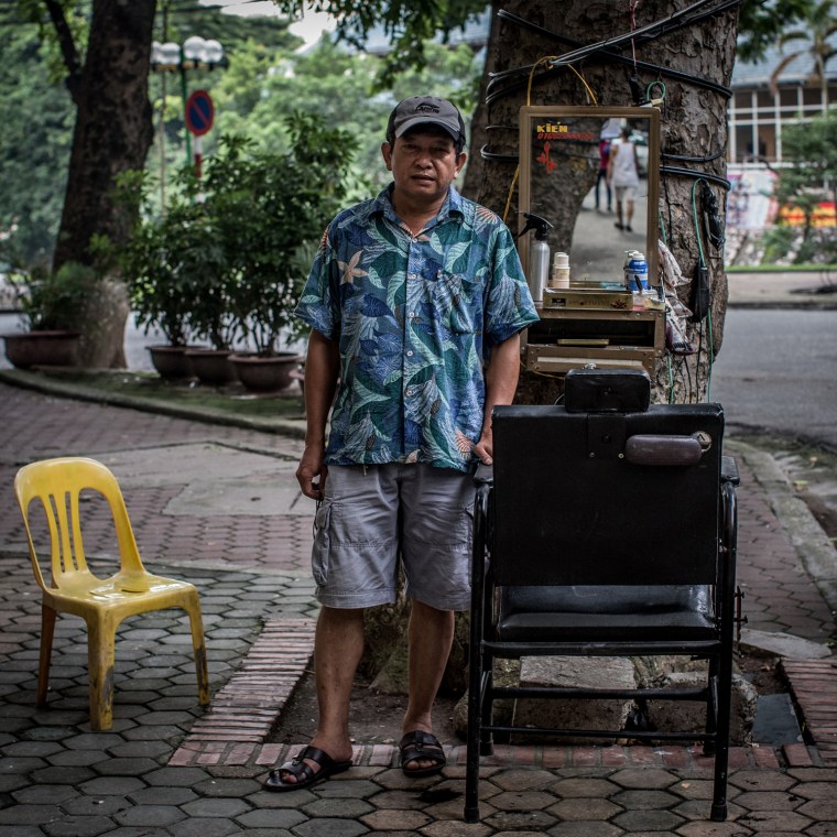 Young and old, Hanoi's street barbers continue long tradition
