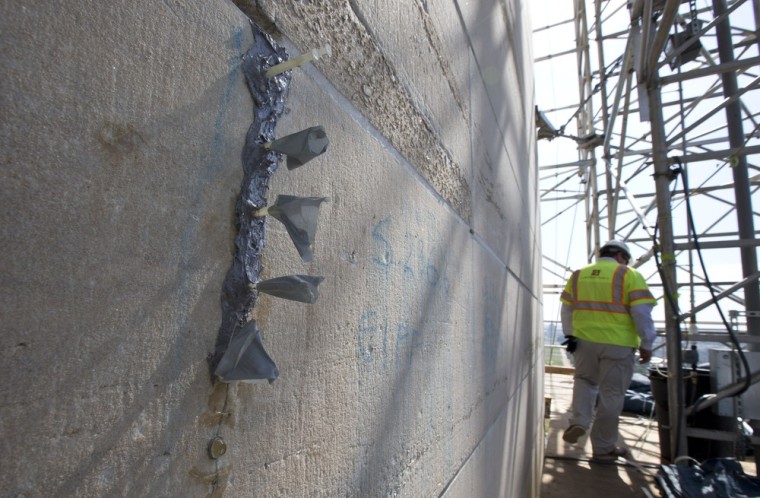 Stone by stone, engineers repair damaged Washington Monument