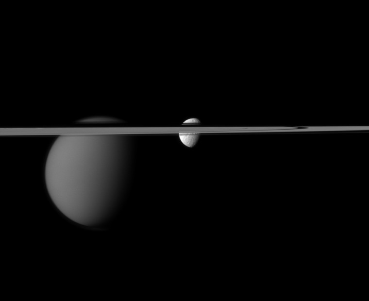 Saturn's moons and rings mix it up