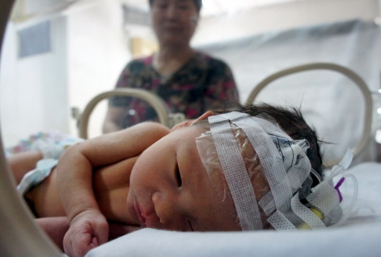 Sewer pipe miracle baby leaves China hospital; No charges for mother