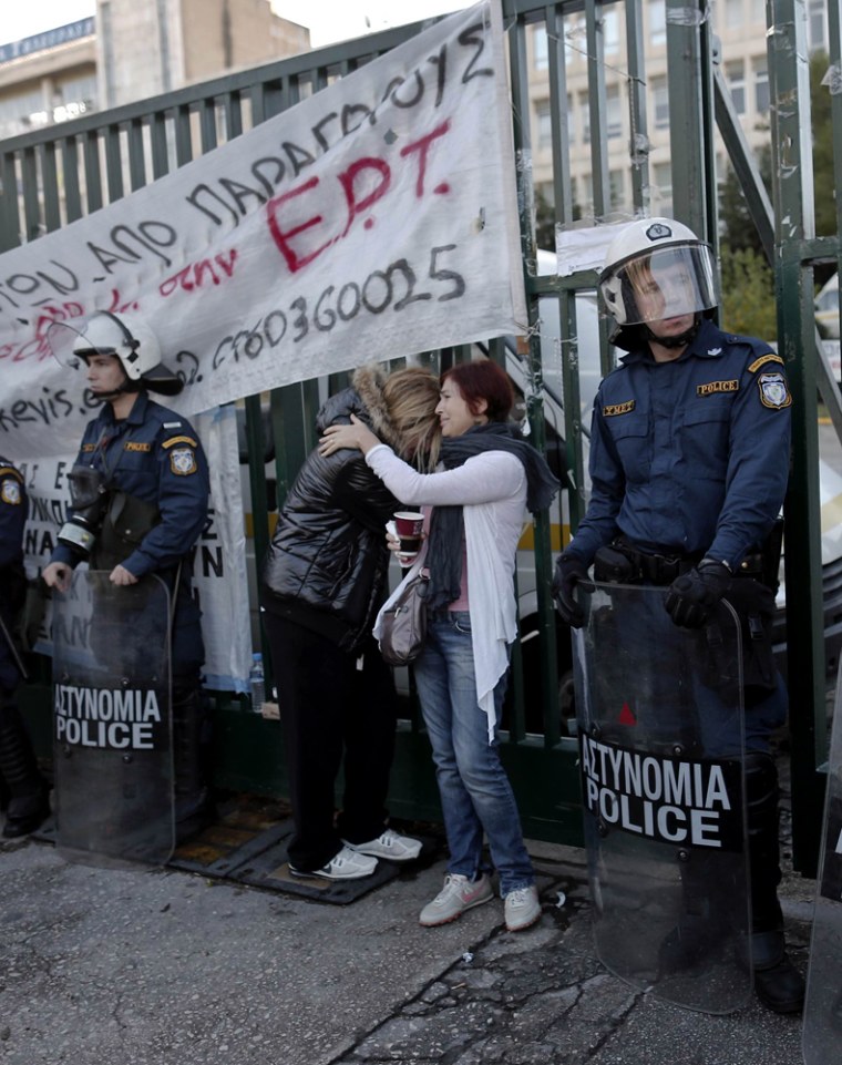Greece's 'Robin Hood' journalists raided by riot police after working ...