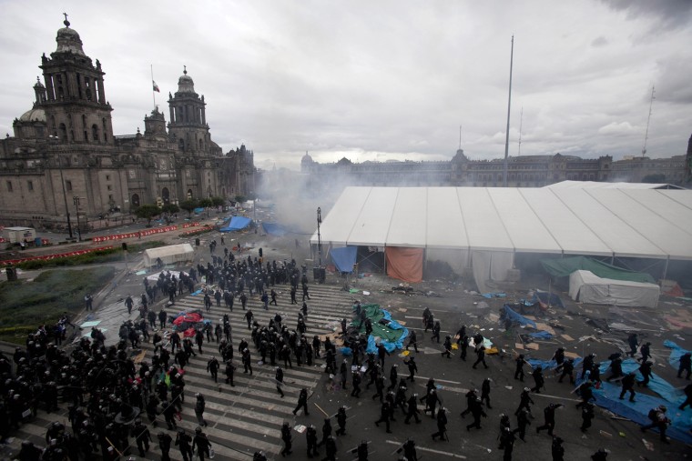 Striking teachers in Mexico cleared out by riot police