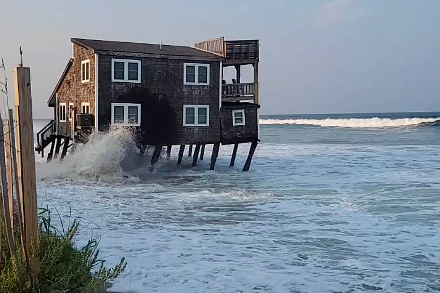 Footage reveals a house in North Carolina collapsing into the Atlantic ...