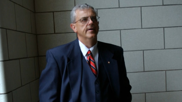 Judge charged with intimidating romantic rival