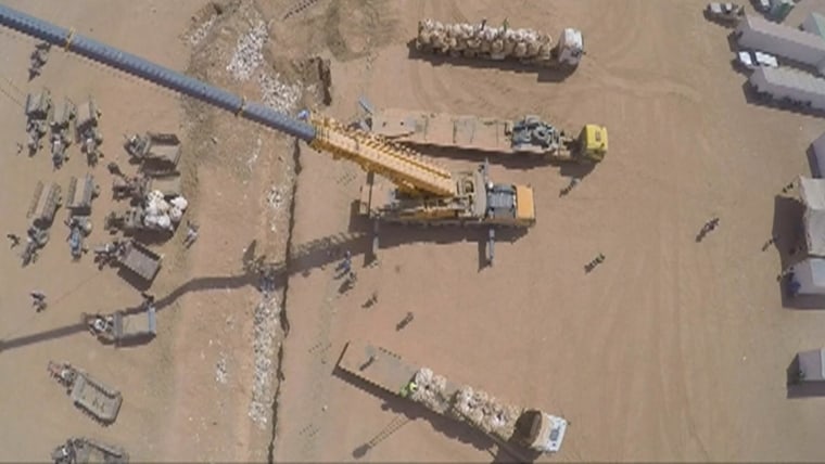 Watch Giant Cranes Lifting Aid Across the Syrian Border