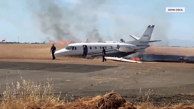 Passengers walk away uninjured after plane bursts into flames at ...