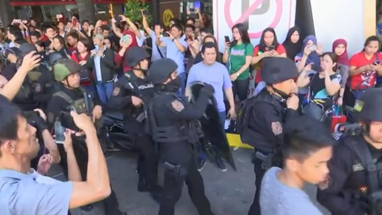 Gunman surrenders after holding dozens hostage at shopping mall