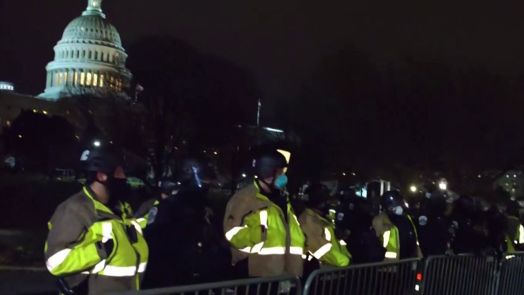 Law enforcement begins to clear rioters from Capitol as curfew takes effect