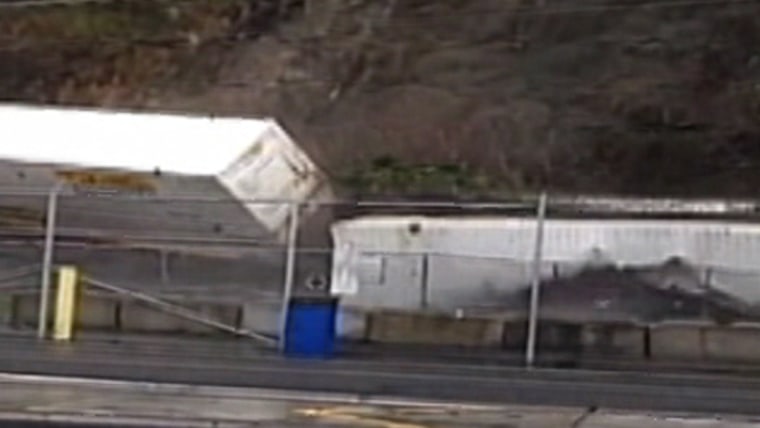 Video captures mudslide derailing train
