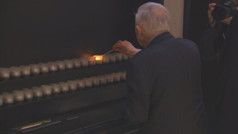 Holocaust Survivors Light Candles to Remember