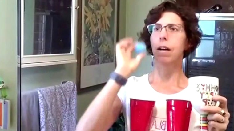 Watch this woman play wine pong all by herself