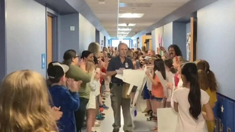 Retiring custodian surprised with mustache sendoff from school