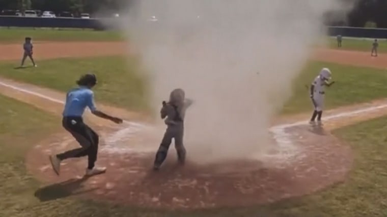 Dust devil disrupts Florida baseball game