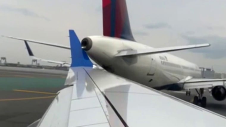 United flight’s wing collides with parked Delta plane’s tail