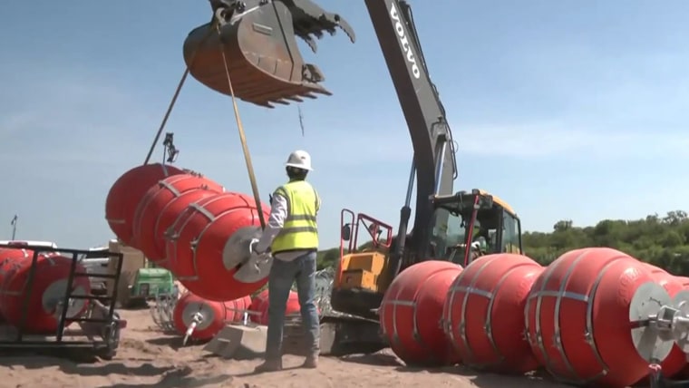 DOJ threatens to sue Texas over floating border barriers