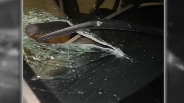 Spear thrown into windshield of moving car, police searching for suspect
