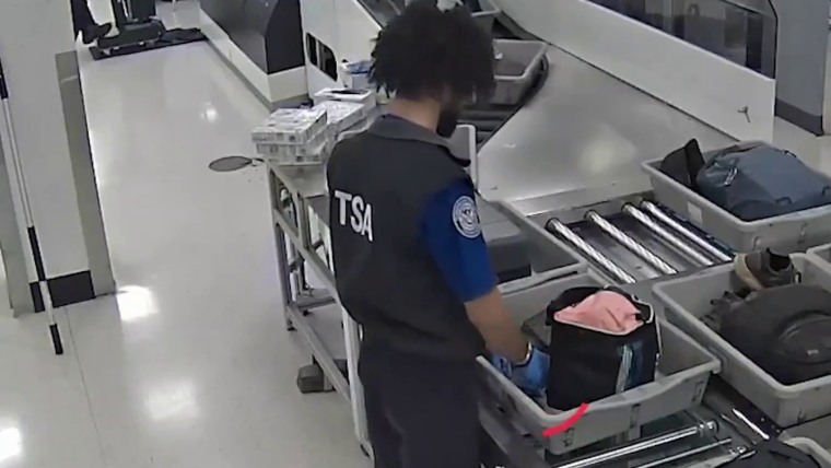 TSA agents caught on camera apparently stealing from passengers' luggage TSA agents caught on camera apparently stealing from passengers' luggage