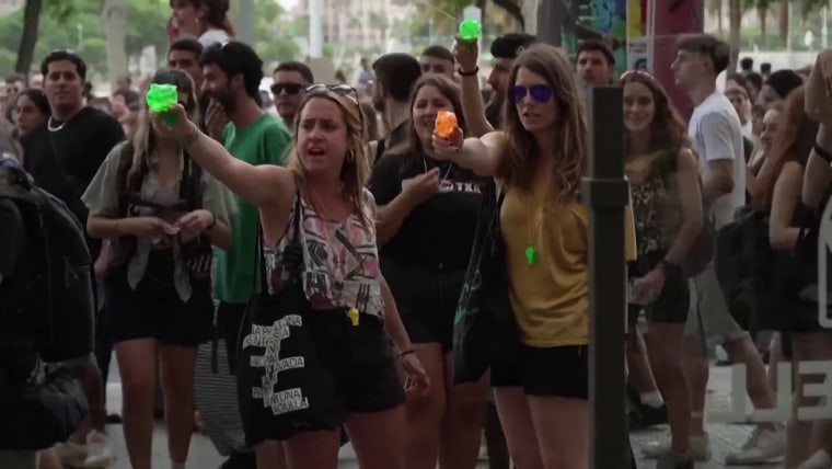 Why Barcelona locals are squirting tourists with water guns