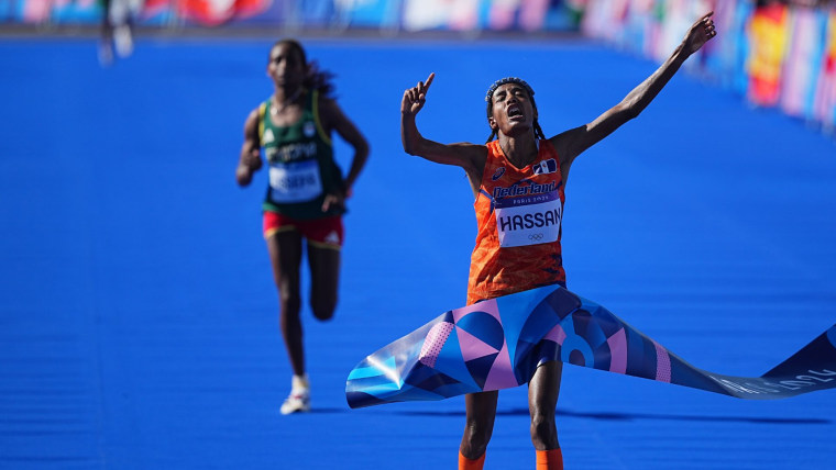 Sifan Hassan wins Olympic marathon in record time for third Paris medal