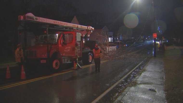 Storm's downpours flood Boston highway, knock out power for thousands ...