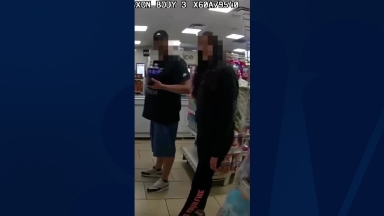 Woman uses hand signal to report suspected abuser