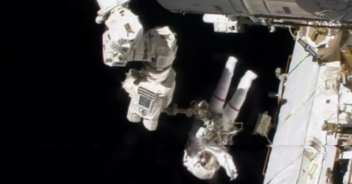 Astronauts mark Moon Day with spacewalk