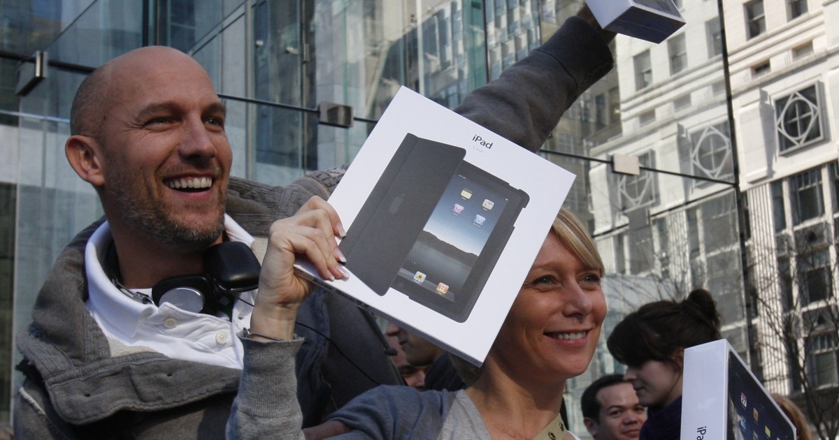 iPad fans eagerly touch and swipe away