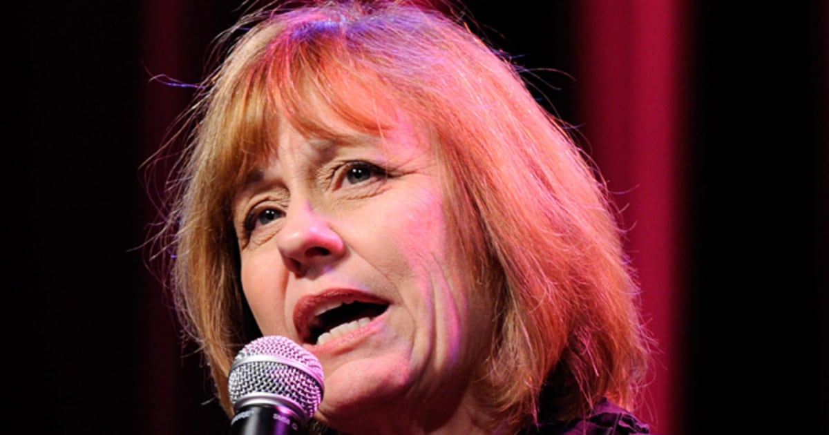 Angle shifts position on public benefits