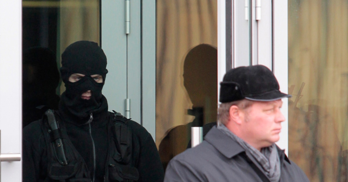Masked police raid Russian tycoon's bank