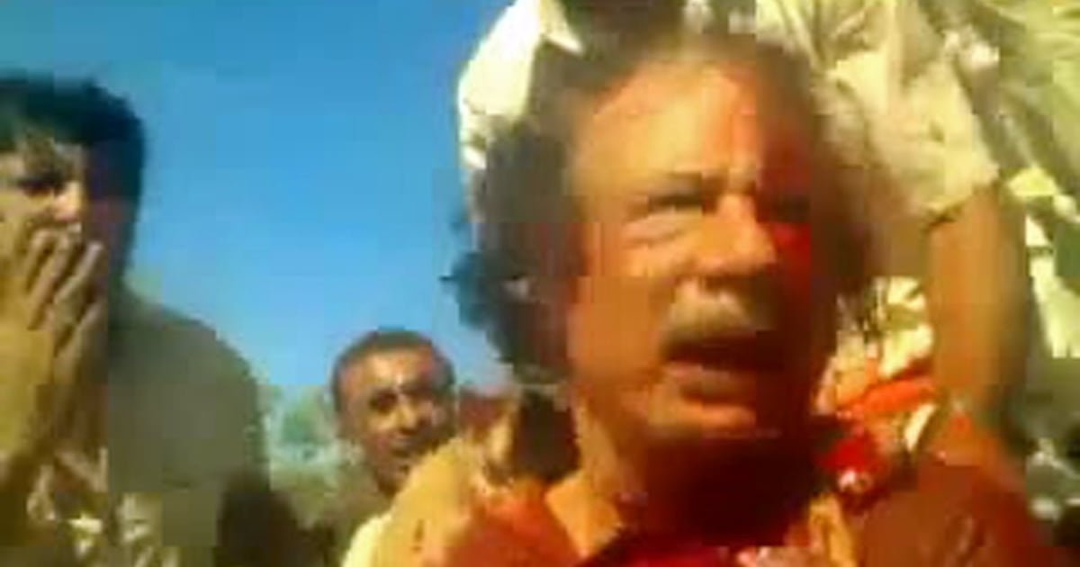 Even stashed in a meat locker, Gadhafi divides Libya