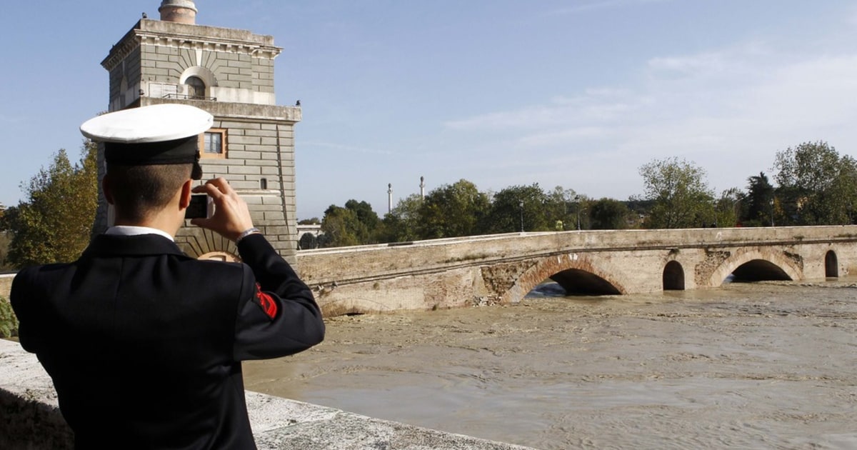Rains swell Rome's Tiber River, flooding suburbs